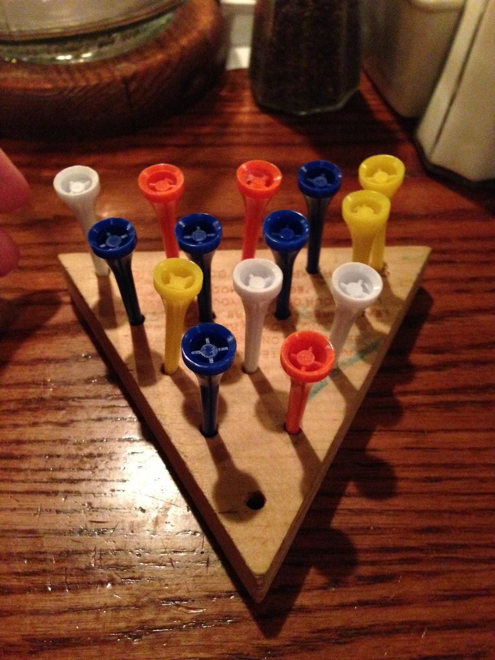 How to solve the triangle peg board game - B+C Guides