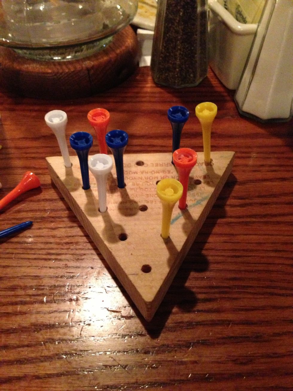 How to solve the triangle peg board game - B+C Guides